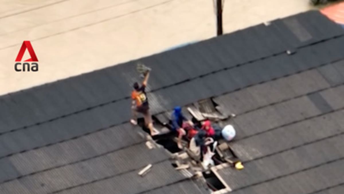 Hat Yai flood: Thai family smashes through roof to escape ravaging ...