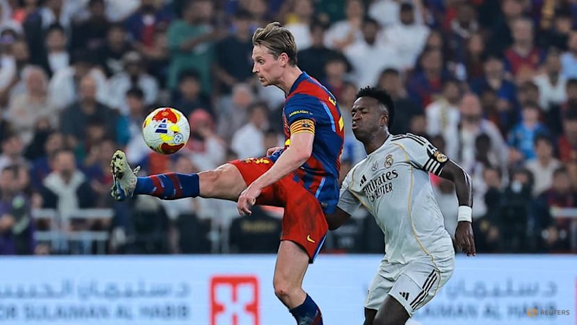 Raphinha strikes twice as Barcelona edge Real Madrid in heated Spanish ...