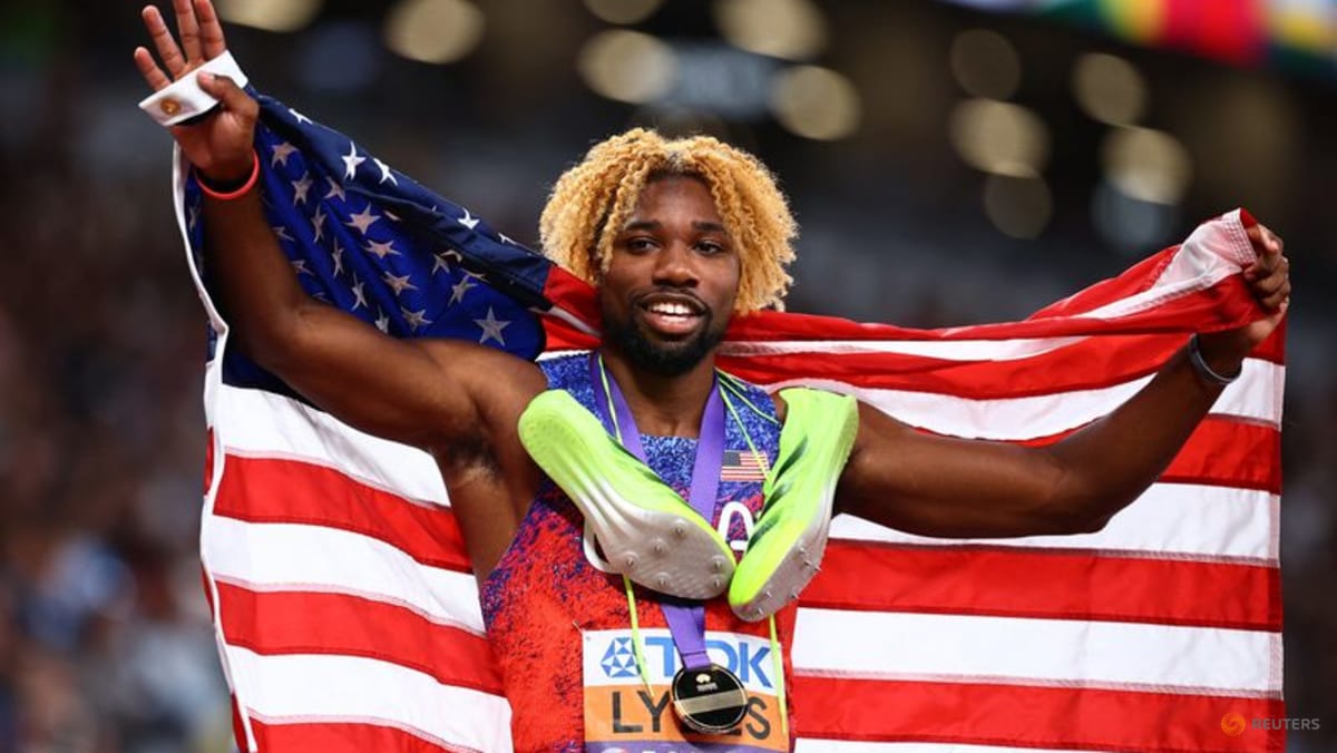 Lyles surges late to win fourth successive 200m gold - CNA