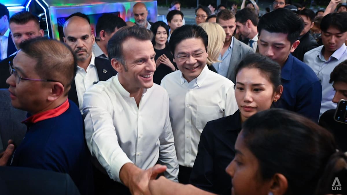 French President Macron and Singapore PM Lawrence Wong visit Lau Pa Sat hawker centre, try local ...