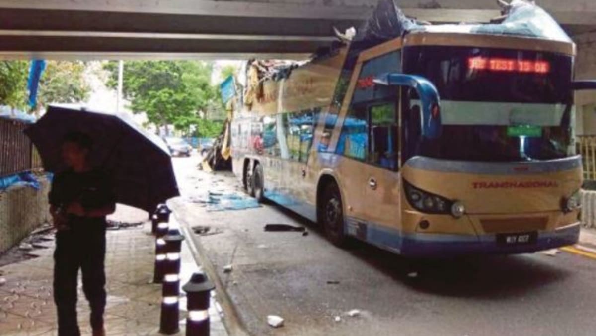 Double-decker bus roof ripped off by bridge in Malaysia - TODAY