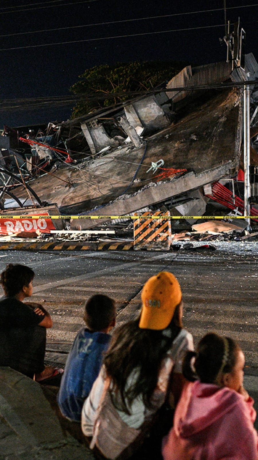 Rescuers race to reach trapped victims after powerful quake in southern ...