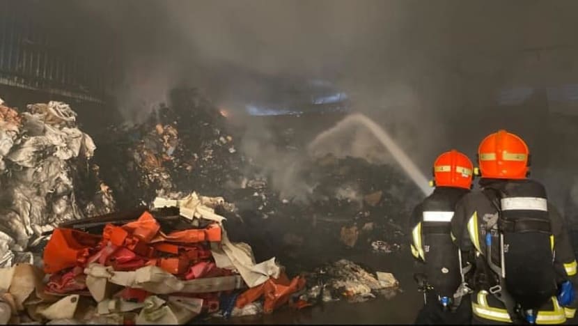 40 firefighters tackle fire involving 'large pile' of construction ...