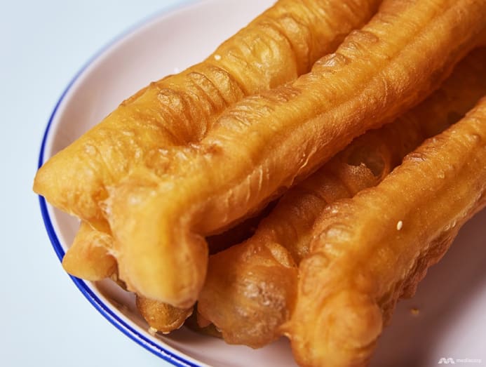 This you tiao hawker has been making these fried snacks from scratch by ...