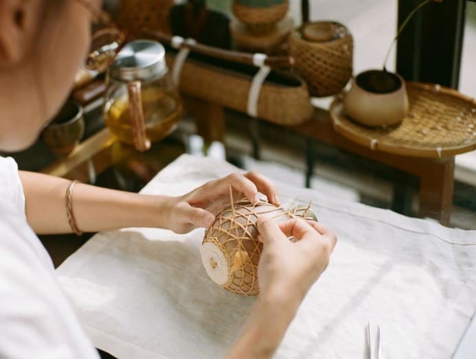 She works in a bank in the day but becomes an expert rattan weaver ...