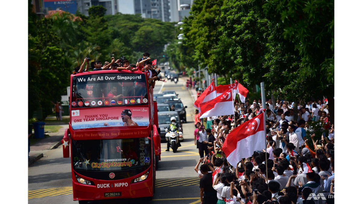 Thousands turn up to cheer Joseph Schooling during victory parade - CNA