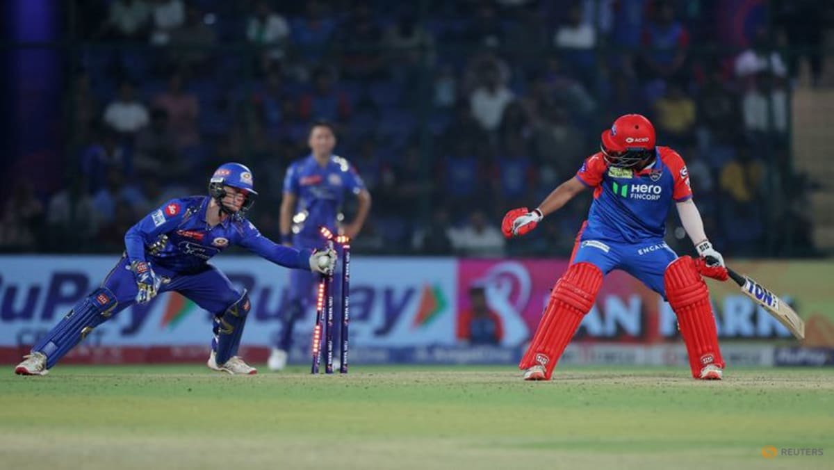 Delhi's unbeaten IPL run ends after a hat-trick of run-outs v Mumbai - CNA