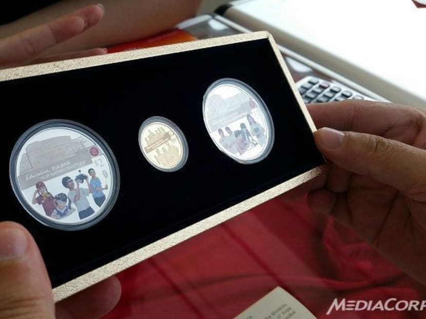 Commemorative SG50 coins launched at tribute event to pioneering ...