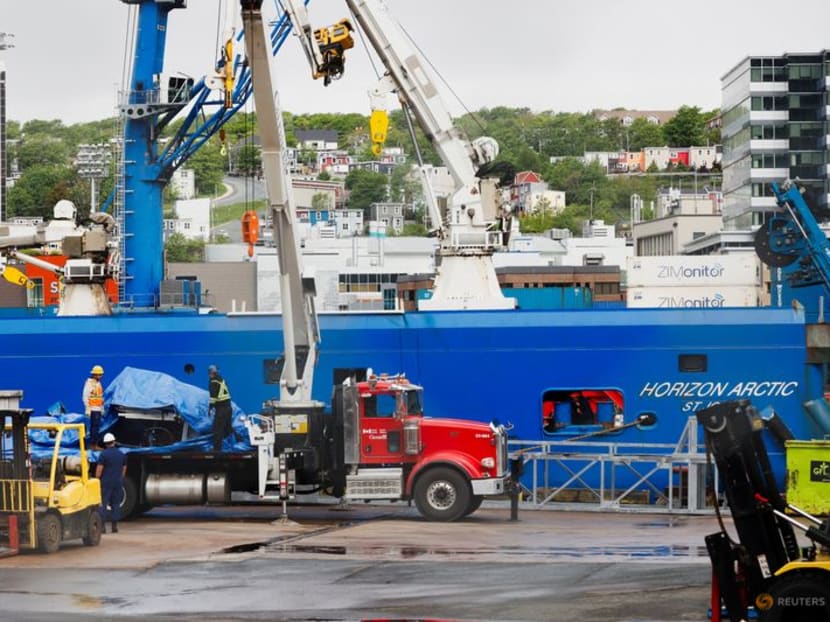 Presumed human remains and shattered Titanic submersible returned to ...