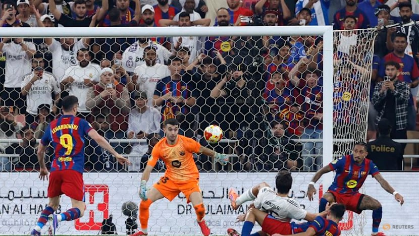 Raphinha strikes twice as Barcelona edge Real Madrid in heated Spanish ...