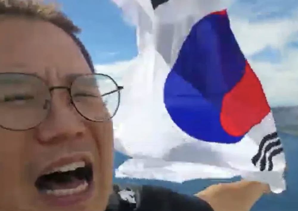 South Korean YouTuber Got In Trouble For Waving KOR Flag & Singing His ...