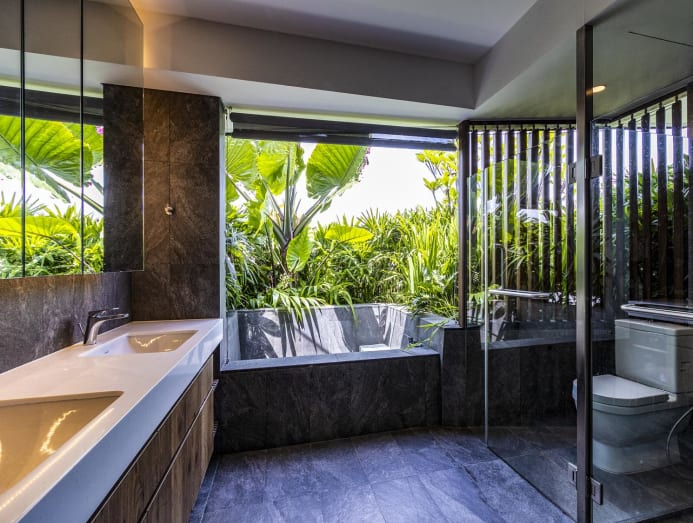 A heated pool in the basement of this Singapore home serves as the ...