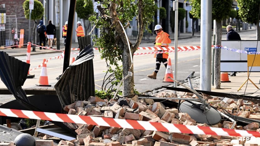 Woman dead, 120,000 without power as damaging storms hit Australia - CNA