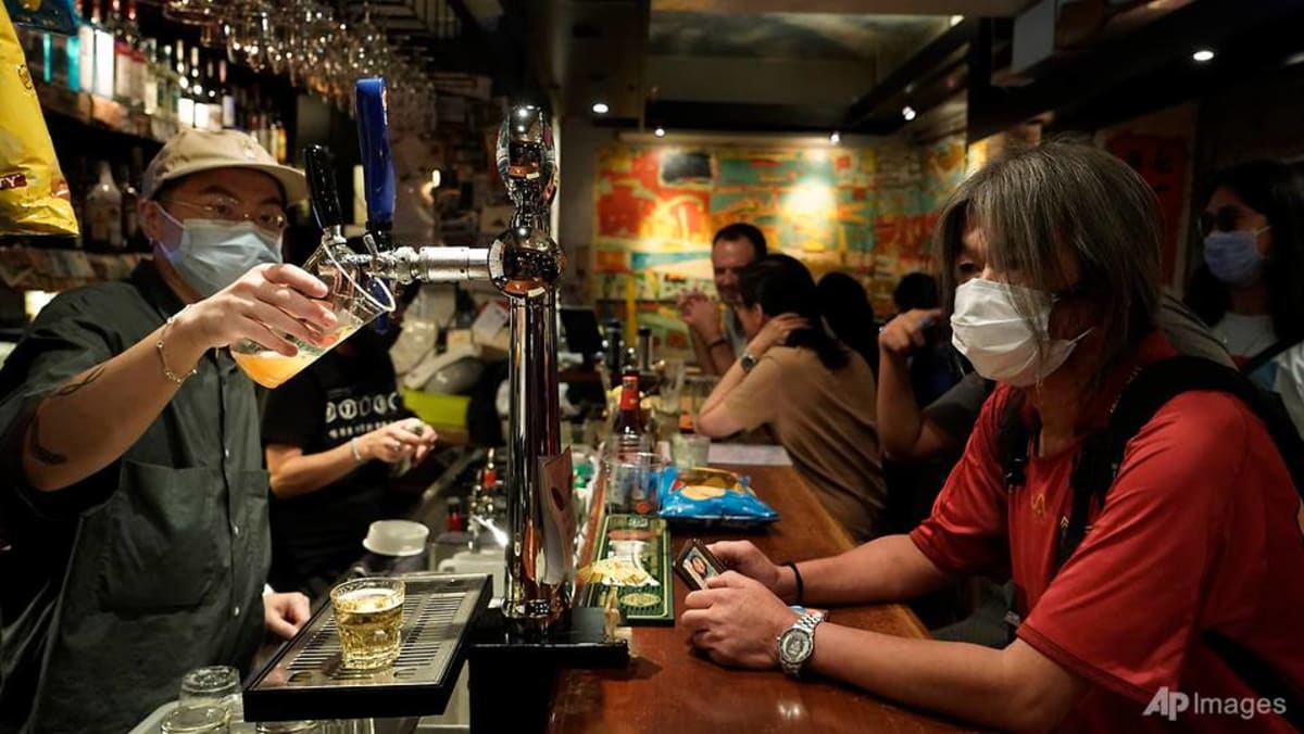 COVID-19 pandemic, politics lead to closure of storied Hong Kong bar - CNA