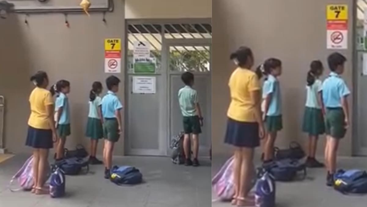 Helper Standing With Primary School Latecomers During S’pore National ...