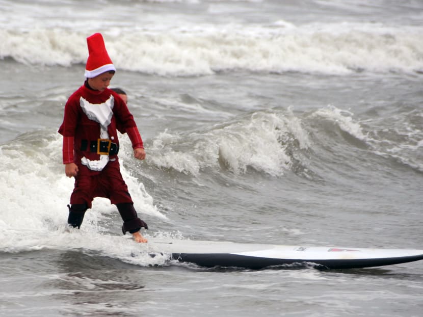Surfing Santas catch Christmas Eve waves in Florida - TODAY